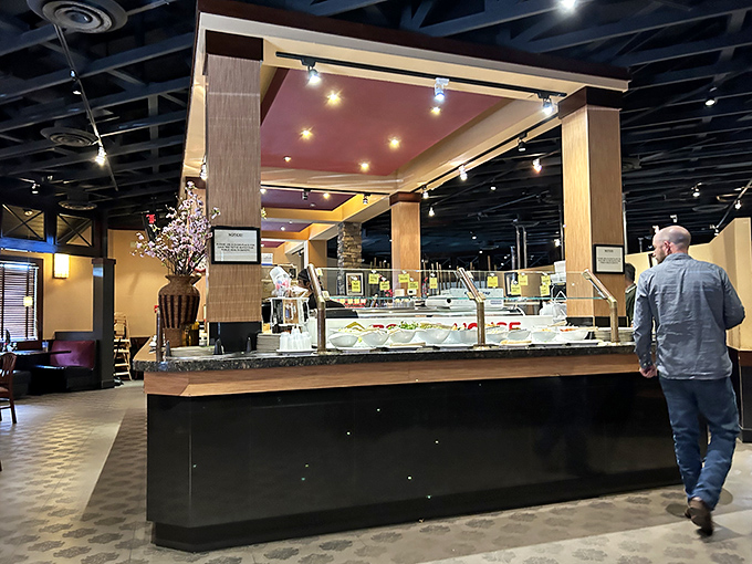 The buffet station where food dreams come true, complete with cherry blossoms that remind you this isn't your average all-you-can-eat experience.