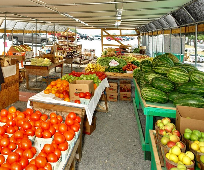 A rainbow of fresh produce that makes supermarket offerings look pale by comparison—nature's candy arranged with prideful precision.