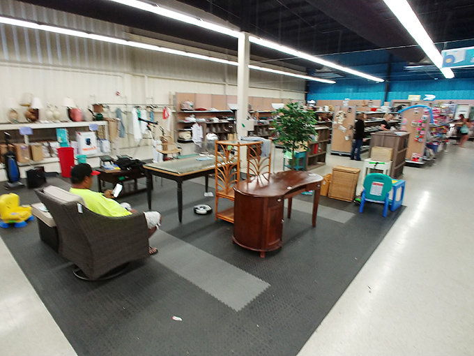 The furniture section: where mid-century meets island casual. That gray armchair has "afternoon nap" written all over it&mdash;metaphorically, of course.