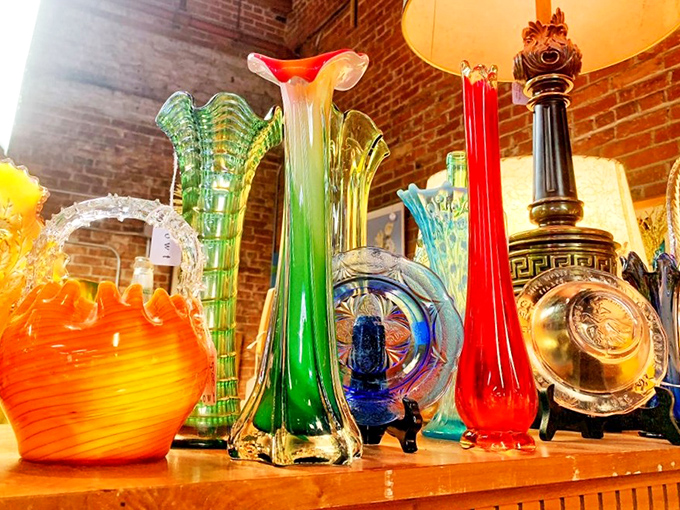 Candy-colored vintage glassware against exposed brick. Mid-century cocktail hour meets industrial chic in this rainbow of vessels.ss vases