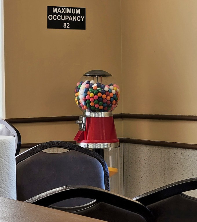That classic gumball machine stands sentinel, promising a colorful sweet finish to your savory feast.