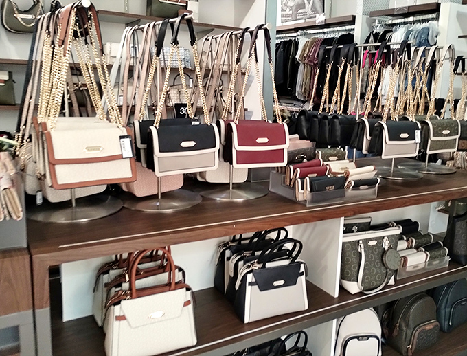 A battalion of handbags standing at attention, each silently arguing why it deserves to be your next impulse purchase.