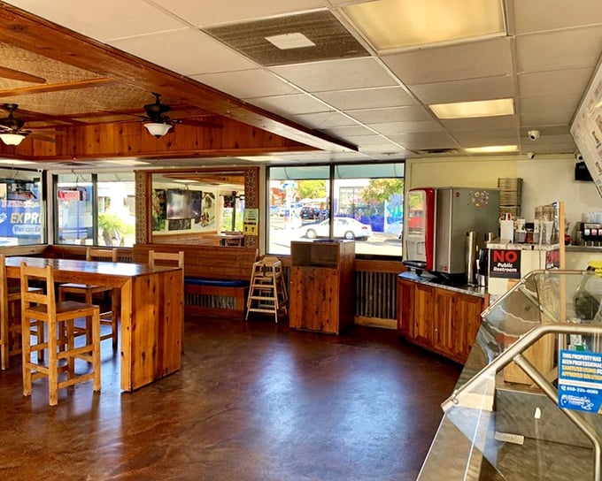 The minimalist interior lets the food do the talking, with wooden chairs that say "stay awhile" and concrete floors that whisper "we're authentic."
