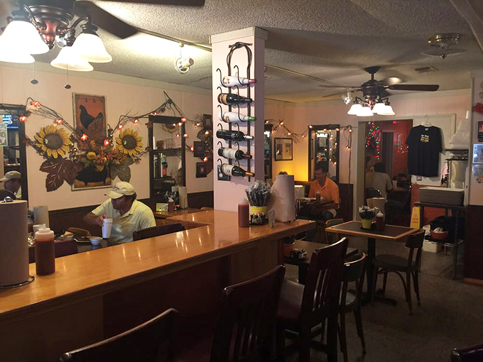 Sunflowers and string lights create that "grandma's kitchen meets smokehouse" ambiance that makes you instantly feel like a regular.
