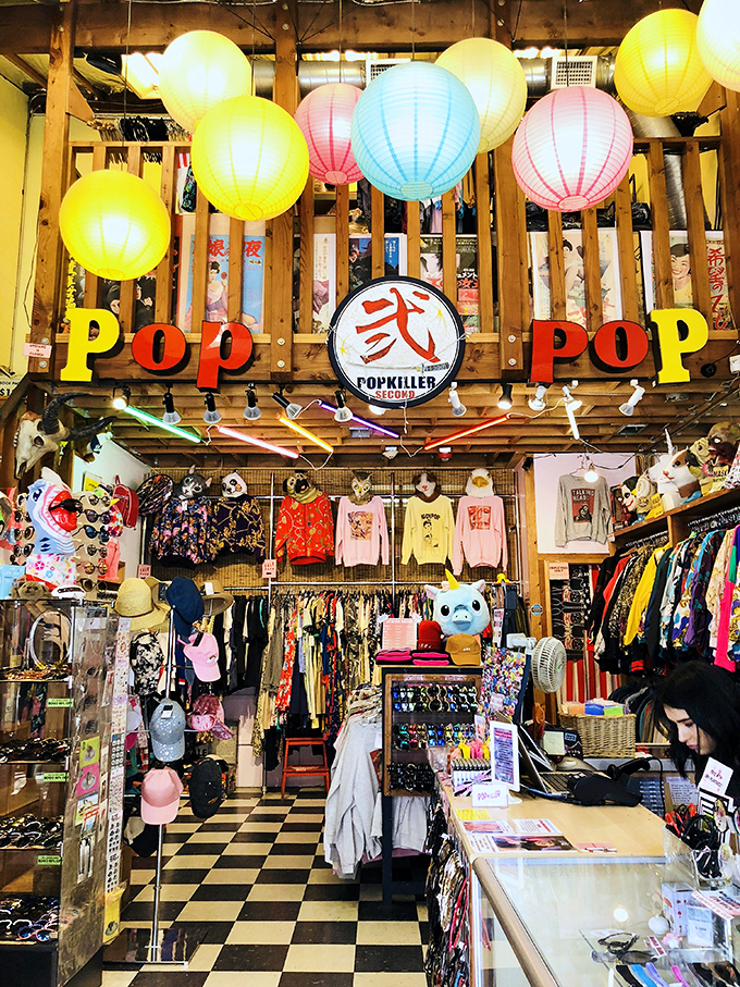 Colorful paper lanterns float above a sea of curated fashion finds. The "POP" sign isn't just decoration&mdash;it's truth in advertising.