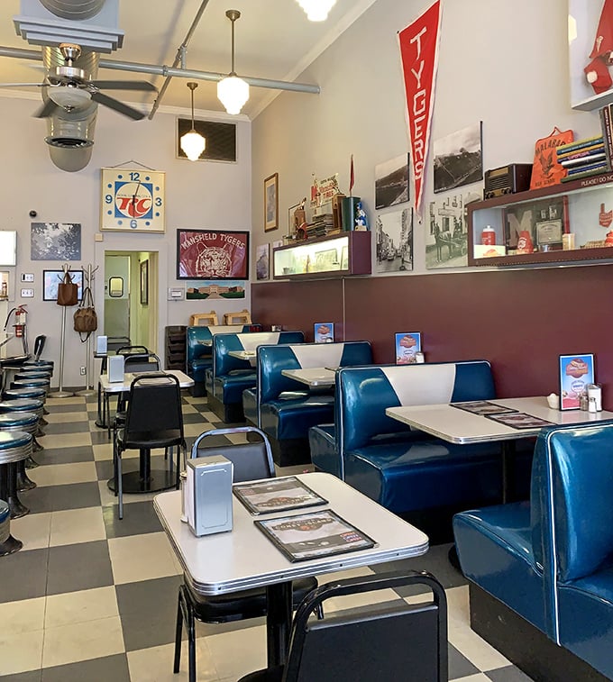 The vintage memorabilia isn't curated by a designer&mdash;it's accumulated by life. Each item has earned its place on these walls.