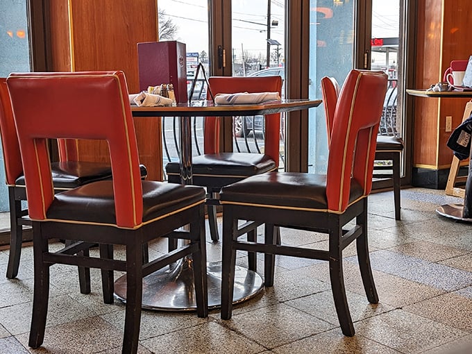 Red chairs pop against dark wood tables, creating a dining room that's both nostalgic and contemporary&mdash;like your favorite oldies remixed by a talented DJ.