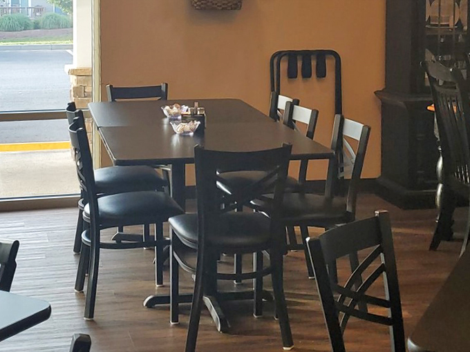 Corner tables perfect for lingering conversations over coffee refills. How many life problems have been solved in these seats?