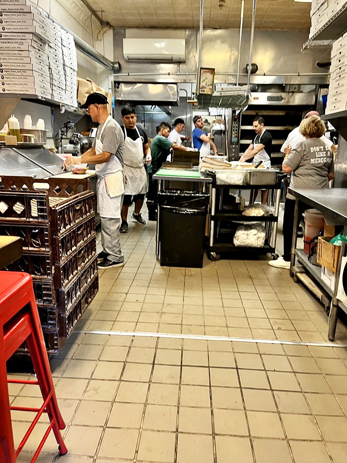 Behind the scenes where the magic happens. This kitchen crew moves with the synchronized precision of Olympic athletes.