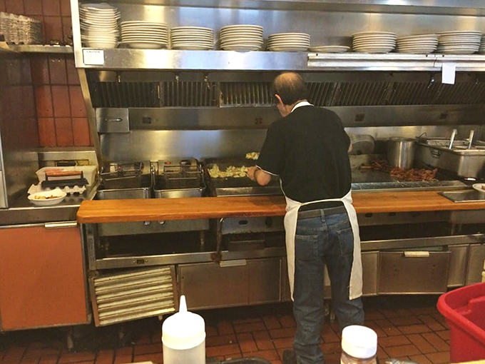 The cook works his griddle like a concert pianist, turning humble ingredients into the comfort food masterpieces that keep regulars coming back.