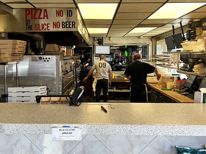 Behind-the-scenes magic where dough becomes dreams. The "No ID, No Beer" sign reminds us some pleasures are worth the wait.
