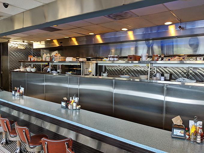 The open kitchen operates like a well-choreographed ballet, where every sizzle and flip contributes to the delicious finale.