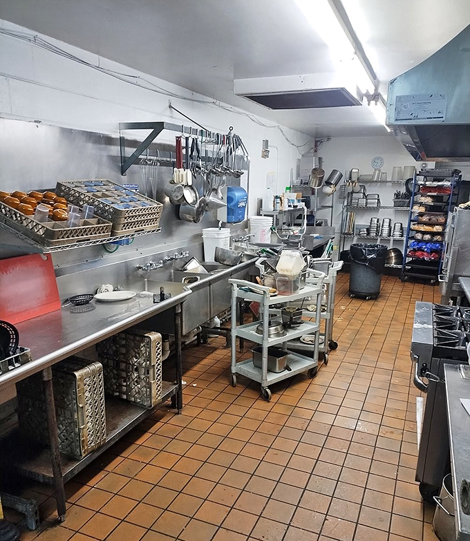 Behind the scenes, the kitchen stands ready for the breakfast rush – a well-organized command center where diner magic happens.