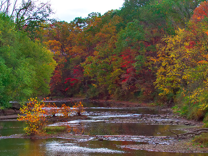 Autumn transforms the Grand River valley into a painter's palette of reds, golds and greens&mdash;nature showing off for visitors to the historic bridge.