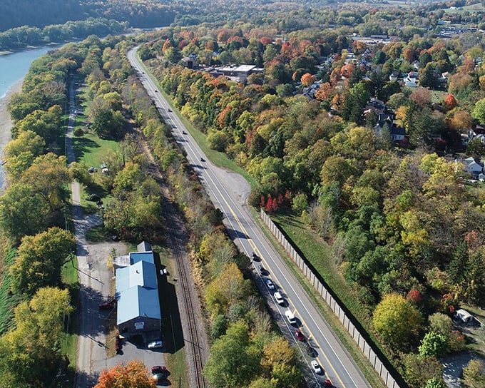The highway hugs the river and forest, offering drivers the kind of scenic route that makes you deliberately ignore your GPS's "faster route available" suggestions.