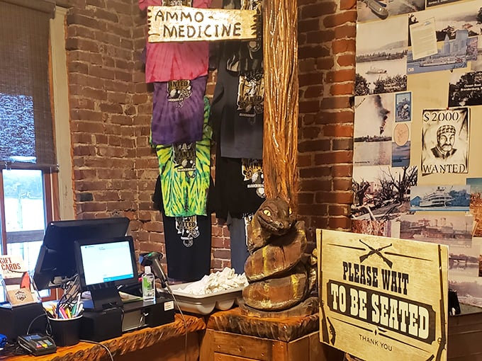 Even the merchandise area maintains the theme. That "Please Wait To Be Seated" sign feels more like "Please Wait For Processing."