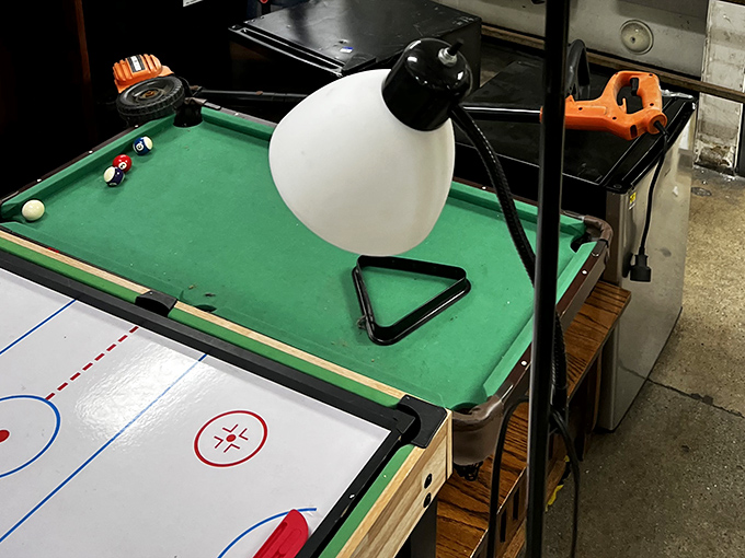 A mini billiard table sits ready to transform someone's game room for less than dinner out.