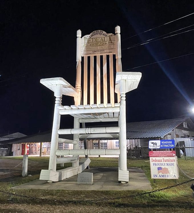 Even at night, the illuminated chair stands sentinel, perhaps waiting for Paul Bunyan to take a load off.