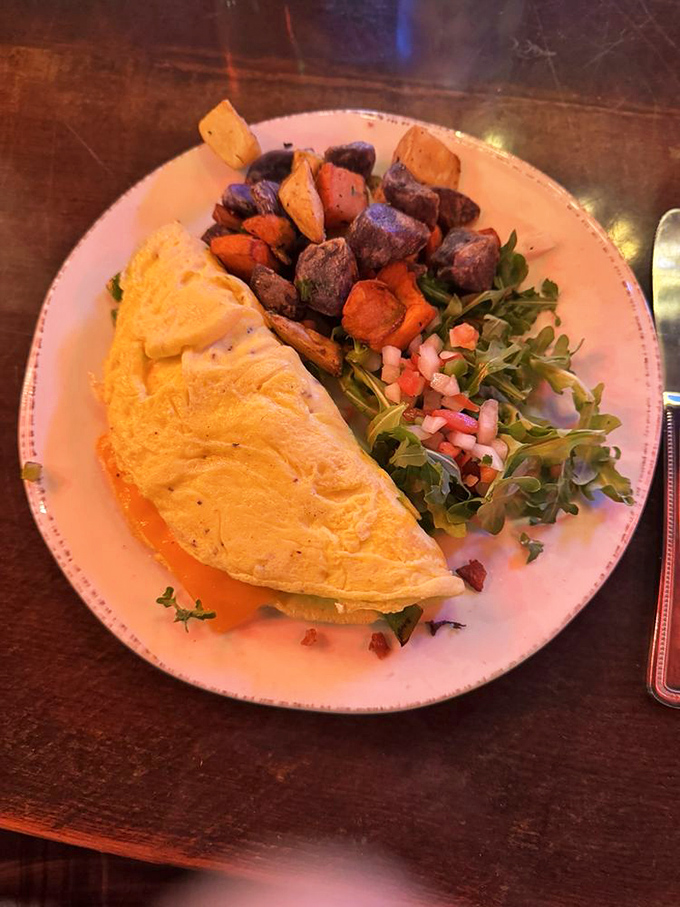 This omelet doesn't just contain ingredients&mdash;it showcases them, folded into a perfect yellow canvas alongside rainbow-hued roasted potatoes.