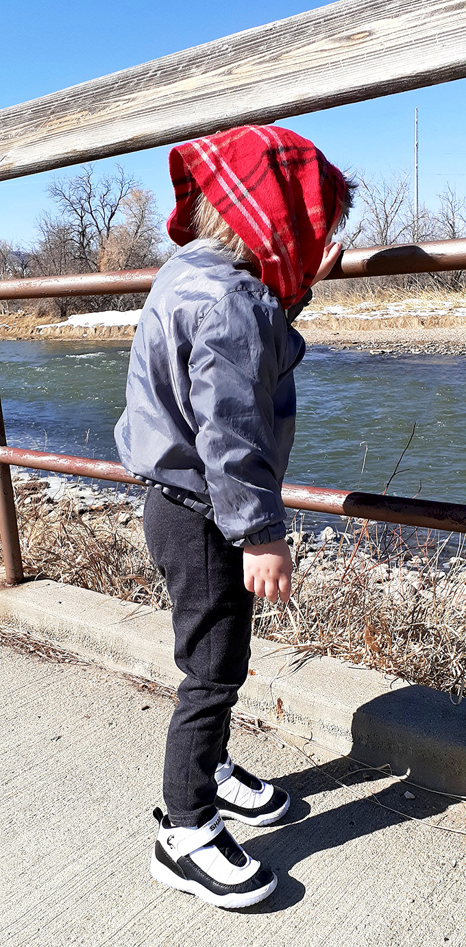 Bundled against Wyoming's brisk air, this young explorer discovers that nature's television&mdash;running water&mdash;beats cartoons any day.