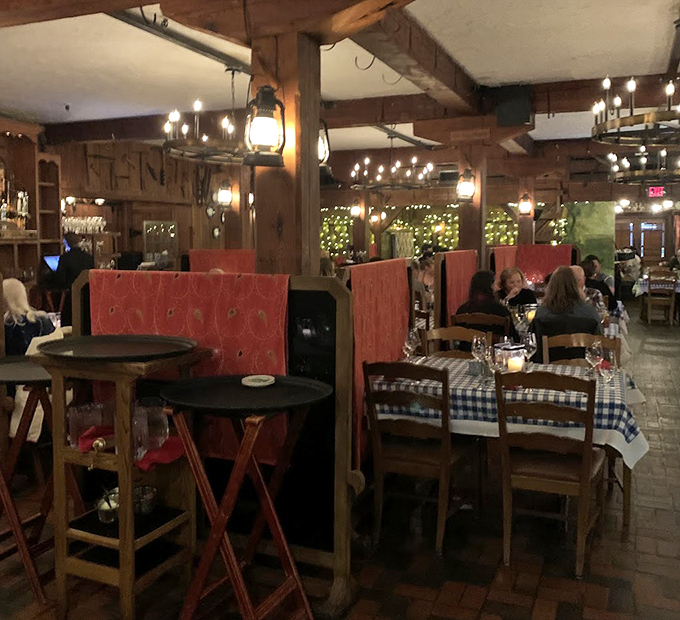 Red booth seating and checkered tablecloths create the perfect stage for memorable meals and conversations that last long after dessert.