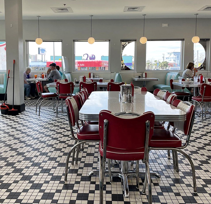 Tables spaced for conversation, chairs designed for comfort&mdash;this isn't just dining, it's a social experience wrapped in mid-century charm.