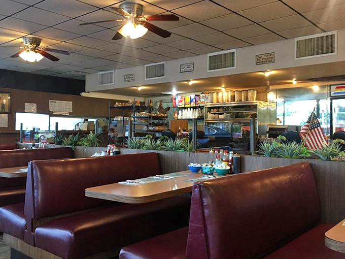 Classic diner architecture with burgundy booths and wood paneling &ndash; not designed by an Instagram influencer, but by decades of knowing what works.