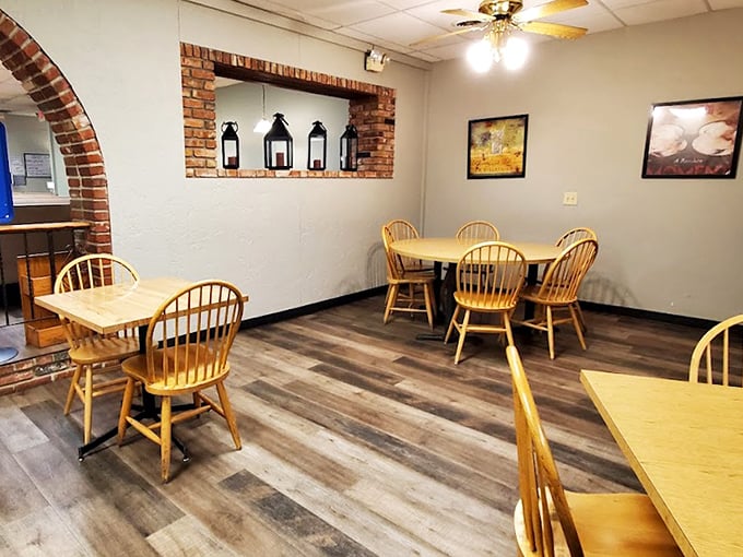Wooden chairs and warm lighting create that "grandma's dining room" feeling that no amount of trendy restaurant design could ever replicate.