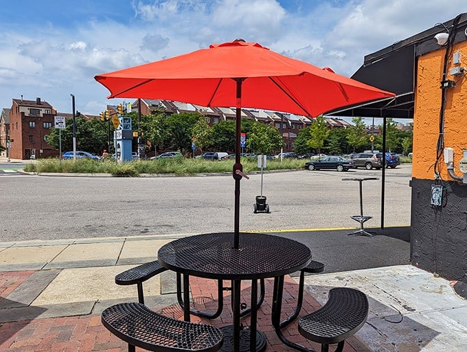 Outdoor dining with a bright orange umbrella &ndash; because nothing complements a cheesesteak better than fresh air and a view of the Philly skyline.