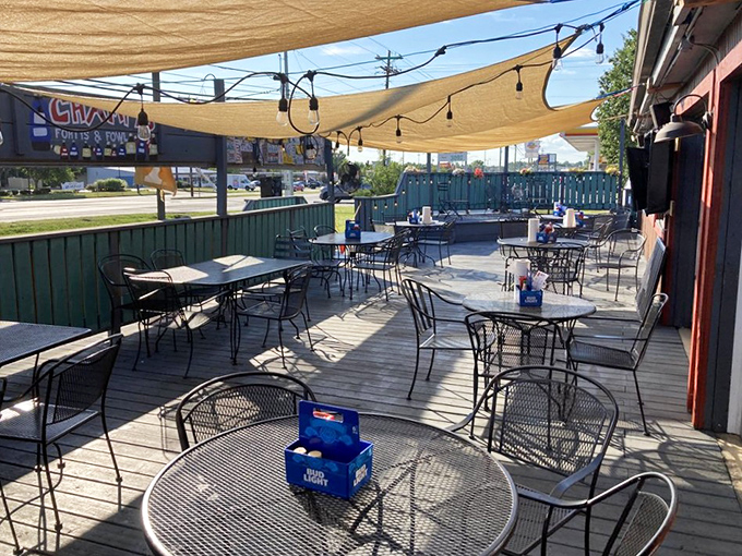The outdoor patio where summer evenings stretch into night, and strangers become friends over shared plates and cold drinks.