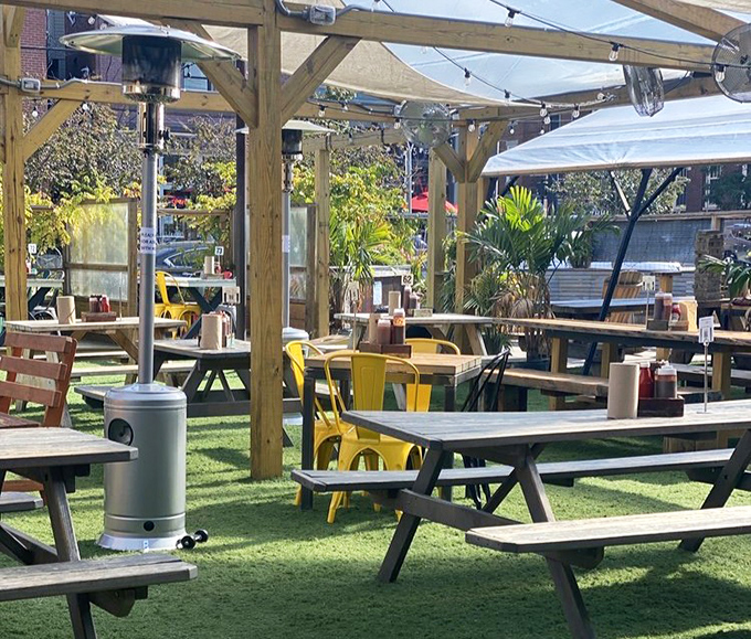The outdoor patio features picnic tables, space heaters, and enough charm to make you forget you're in the city. BBQ always tastes better with a side of fresh air.