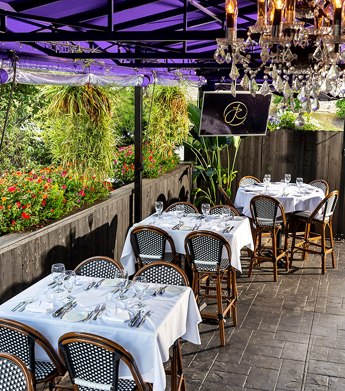 Outdoor dining with crystal chandeliers—because why shouldn't your al fresco experience come with a side of glamour?