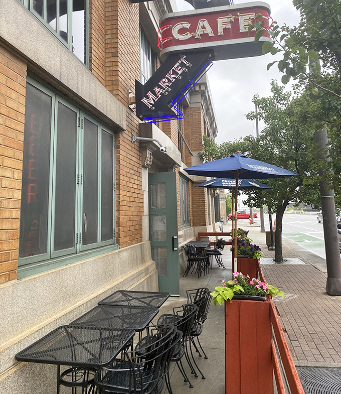 Sidewalk seating that transforms ordinary weekday lunches into mini-vacations. Those blue umbrellas have sheltered countless perfect bites.