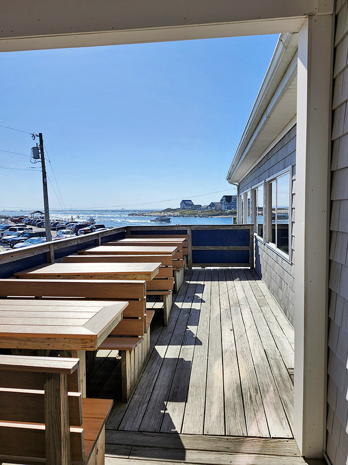 Outdoor seating that turns lunch into an event. These wooden benches have supported more happy diners than a Weight Watchers support group.