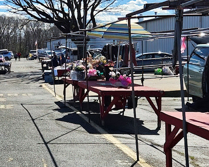 Spring sunshine bathes outdoor vendor tables. Artificial flowers add pops of color that will never wilt&mdash;perfect for the chronically forgetful gardener.