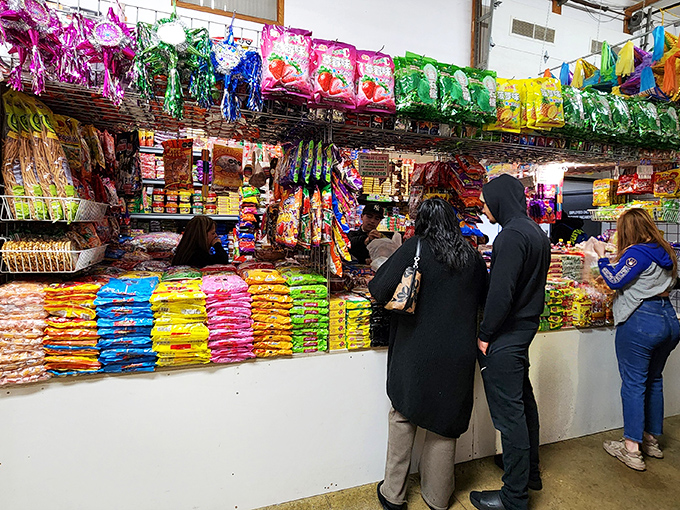 Colorful packaged snacks line the shelves like edible confetti, perfect for satisfying cravings from cultures worldwide.