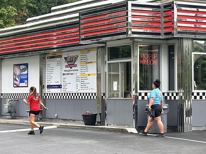At the pick-up window, the transition point where kitchen creations become memorable meals, staff efficiently serve customers who prefer to grab and go.
