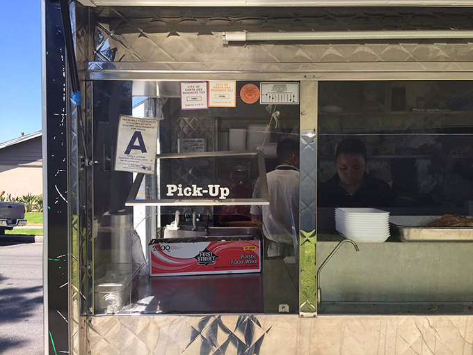 The pick-up window: where dreams come true and patience is rewarded with packages of pure culinary joy.