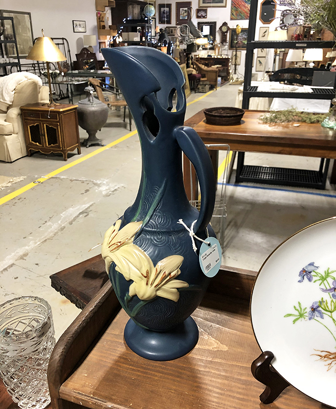 This blue pitcher with its delicate lily isn't just a vase&mdash;it's functional pottery elevated to art, the kind that makes tap water feel fancy.