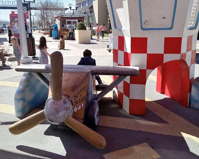 This whimsical airplane play area gives kids a chance to pilot their imagination while parents pilot shopping carts through a sea of sales.