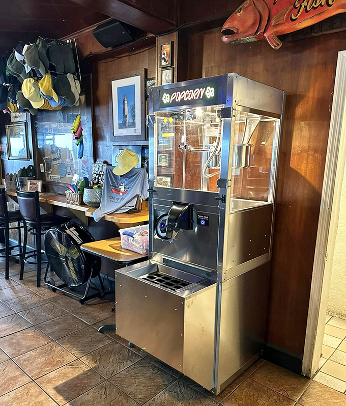 The popcorn machine &ndash; silent sentinel of snacking, providing the perfect salty companion to cold beer and hot island gossip.
