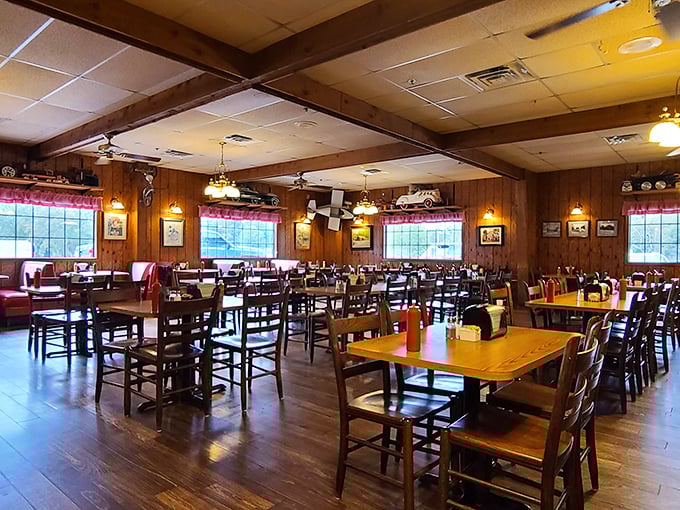 The dining room waits patiently between rushes, wooden chairs and tables bearing the honorable scars of decades of satisfied elbows and happy conversations.