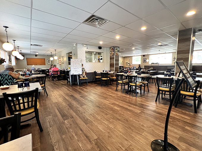 The dining room buzzes with conversation and clinking silverware—the soundtrack of a community gathering place that feels like home.