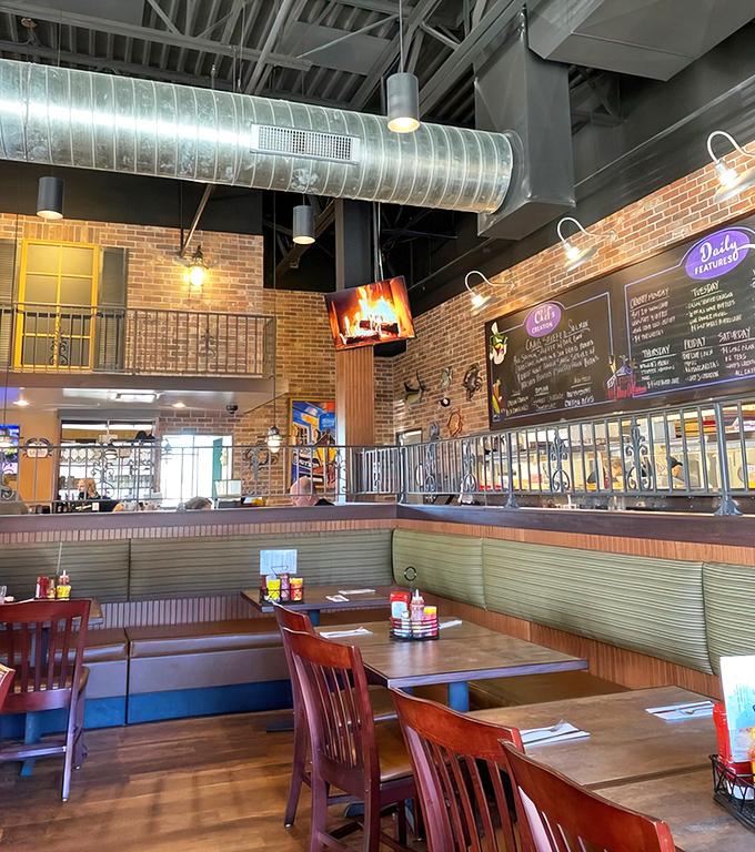 Booth seating with exposed brick and ductwork creates that perfect "industrial meets beach shack" vibe that somehow works beautifully.