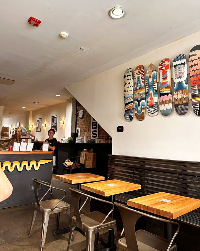 Those colorful skateboards aren't just decoration; they're a reminder that this place has both street cred and sandwich cred.