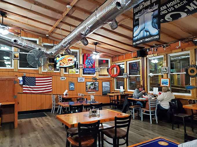 Wood paneling, American flags, and the gentle hum of seafood stories being exchanged—this isn't just dining, it's a Virginia tradition.