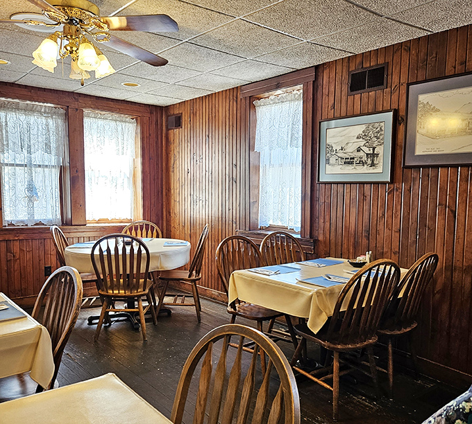 Sunlight streams through lace curtains onto butter-yellow tablecloths&mdash;Norman Rockwell couldn't have painted it better.