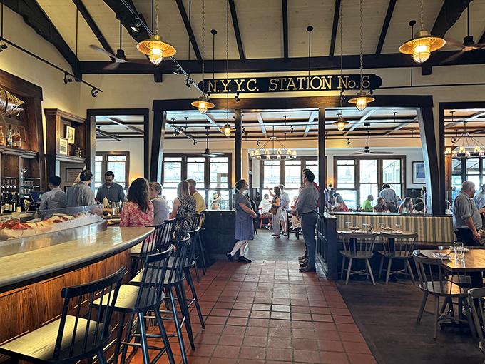 White-washed dining area with harbor views where boats drift by, reminding you that life can actually be this pleasant sometimes. 