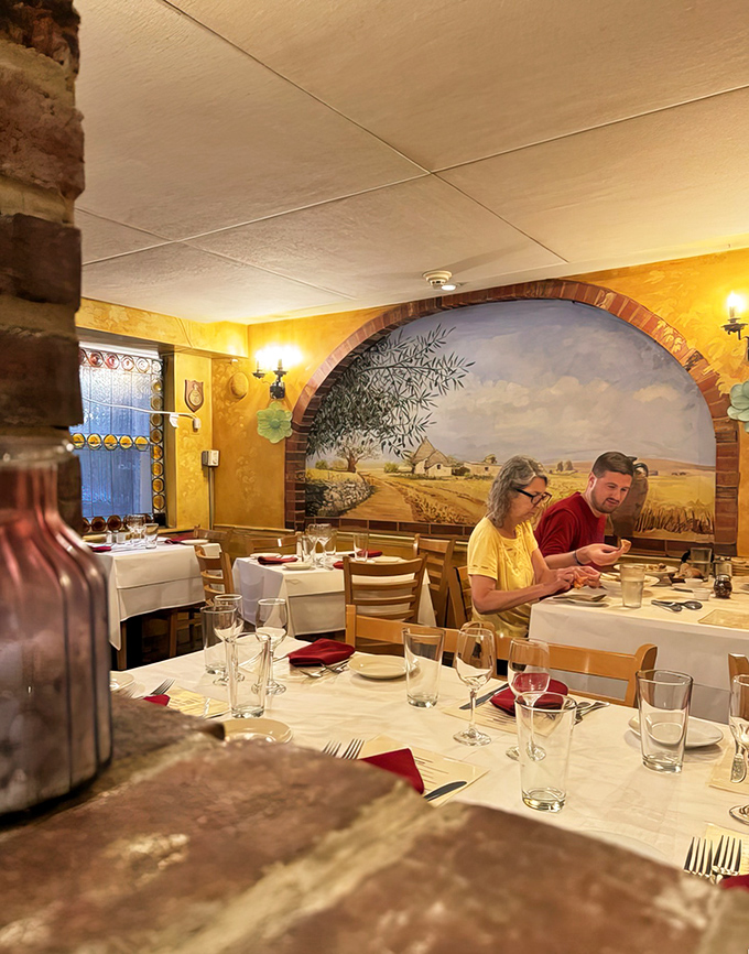 Golden light bathes the dining room in a glow that makes everyone look like they've just returned from a Mediterranean vacation. Food tastes better in this light.