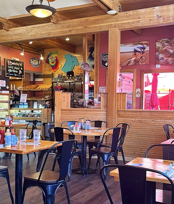 Rustic wooden dividers and metal chairs create distinct dining zones, perfect for both intimate breakfast dates and eavesdropping on hiking recommendations.